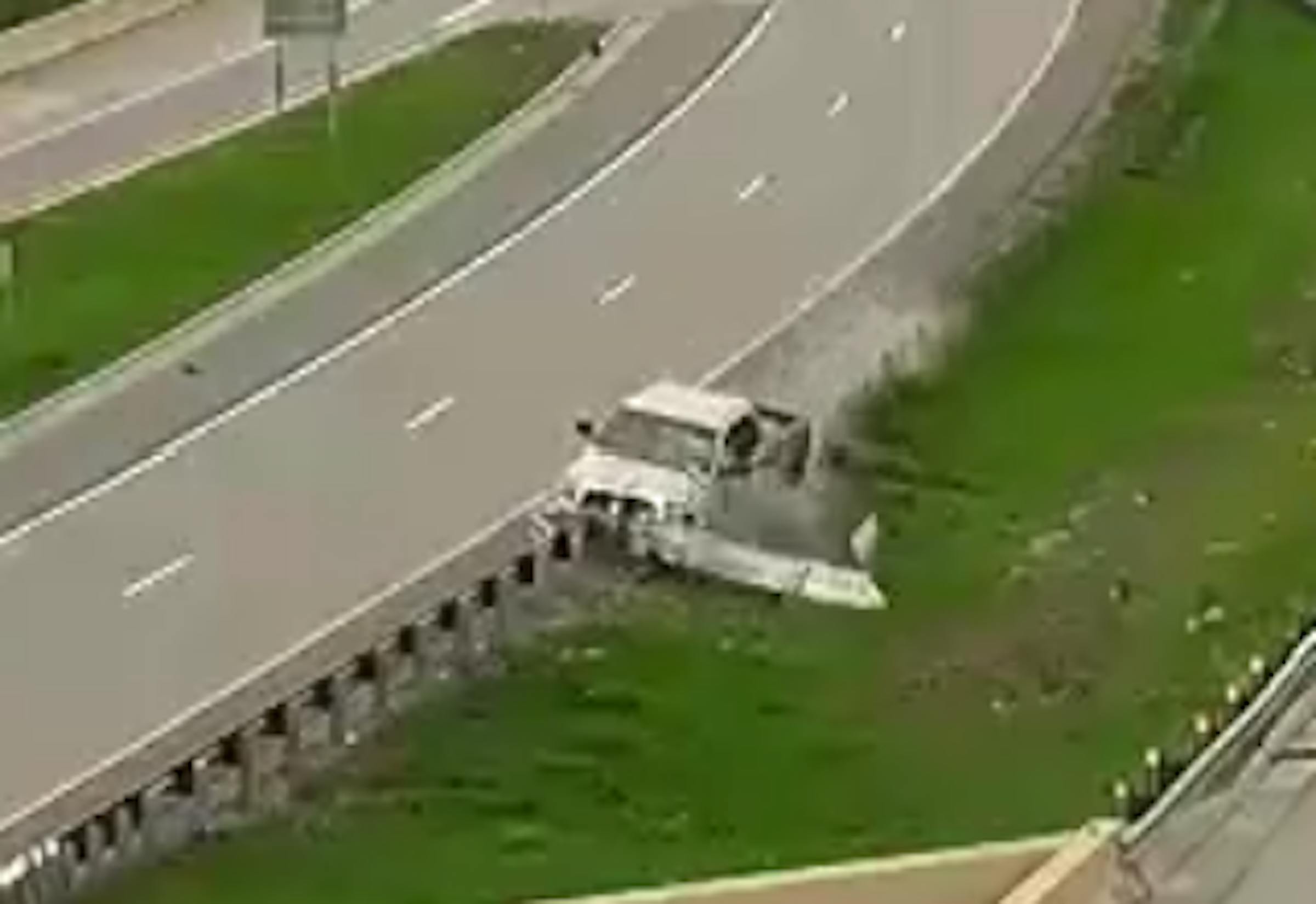 Pickup driver crashes into I-694 guardrail, barrel-rolls over concrete wall to road below